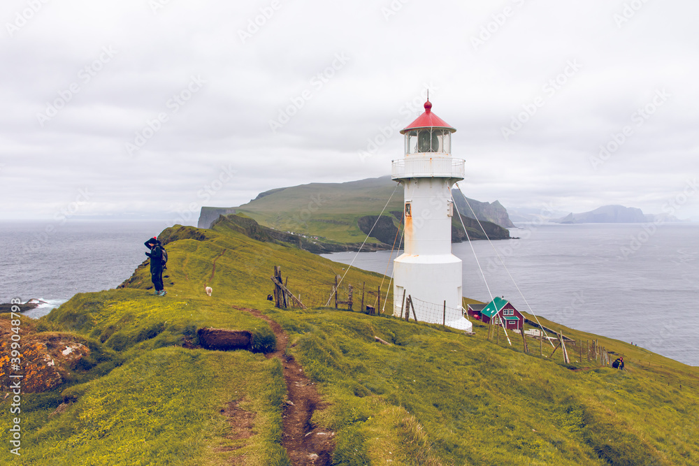 View of lighthouse at Mykines island in Faroe Islands, North Atlantic ...