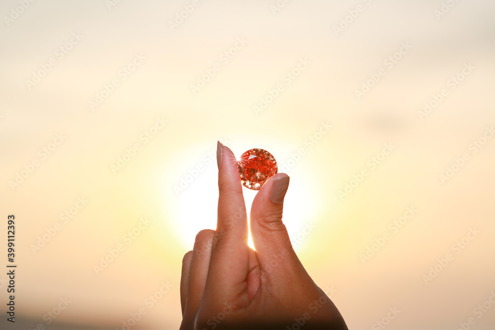 .pick the red ruby diamond in to the sun at Patong beach,Phuket. Stock ...