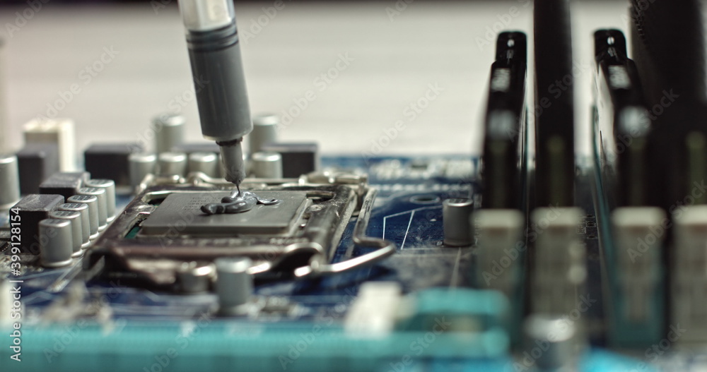 Build computer concept. Close-up shot of applying thermal paste on cpu. 4k footage. Close-up of ...