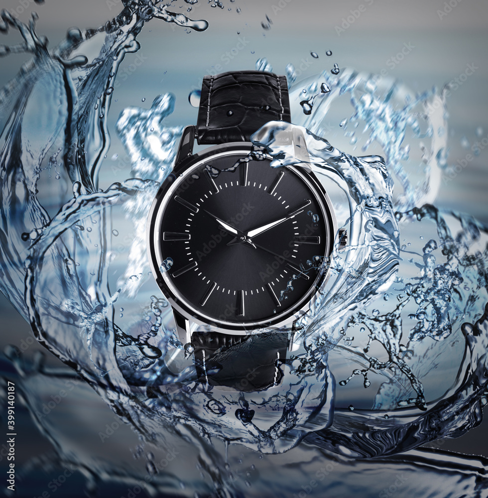 Luxury men's watch in water splashes demonstrating its waterproof Stock ...