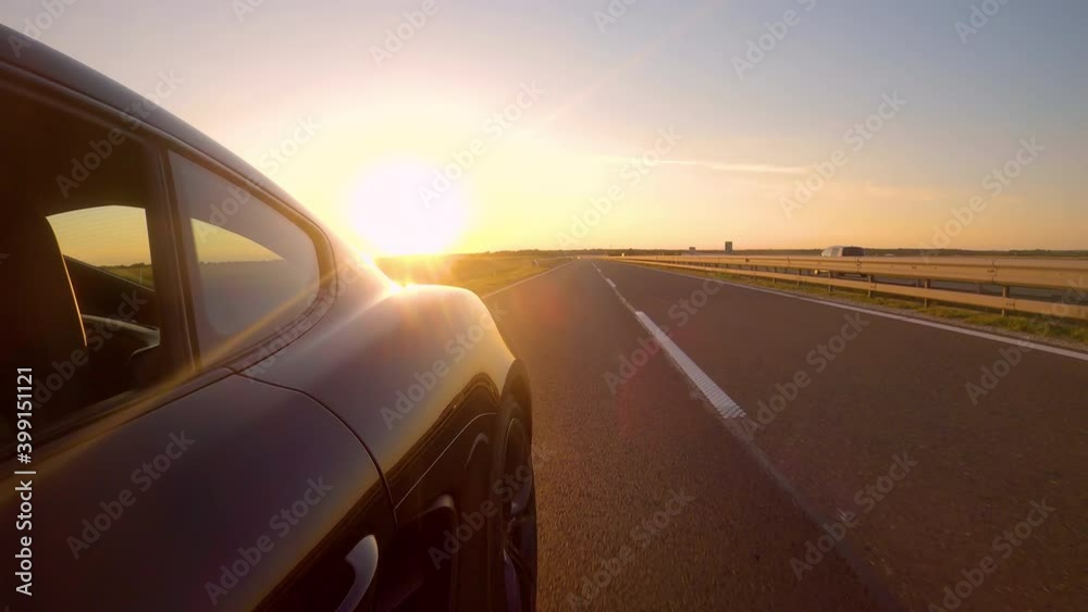 CLOSE UP, LENS FLARE: Beautiful summer sunrise illuminates the black ...