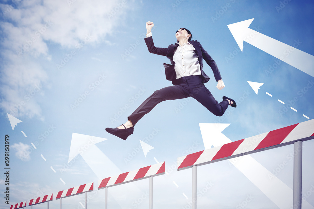 Businesswoman jumping through hurdles with arrows Stock Photo | Adobe Stock