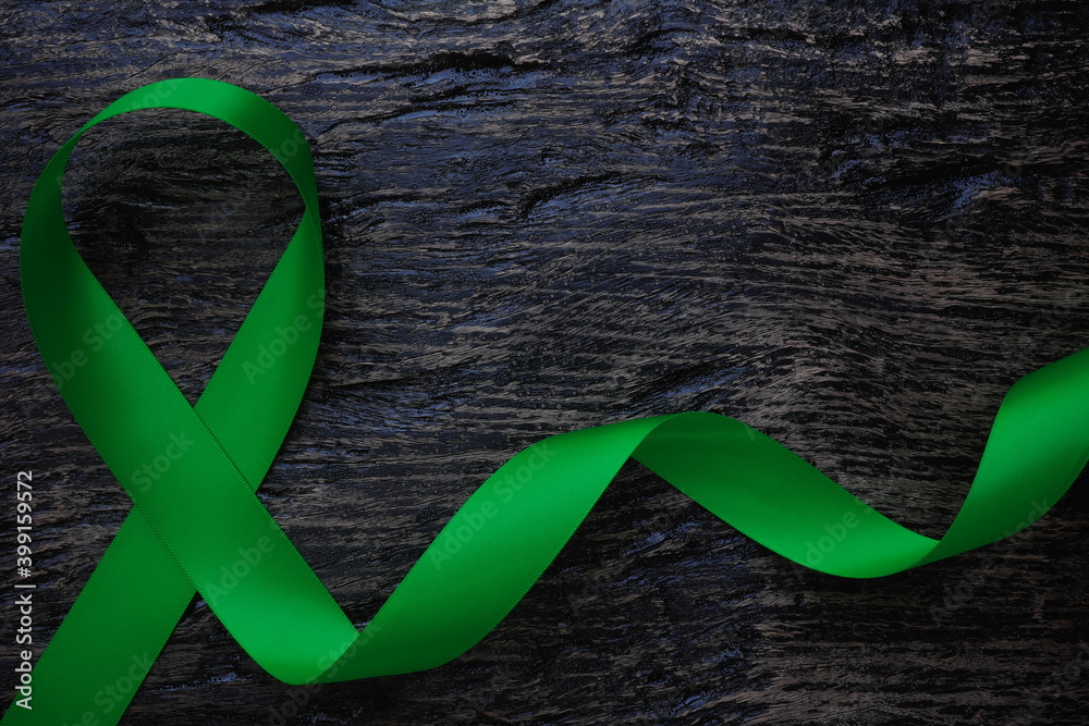 Top view of green color ribbon on dark background. Gall bladder and ...