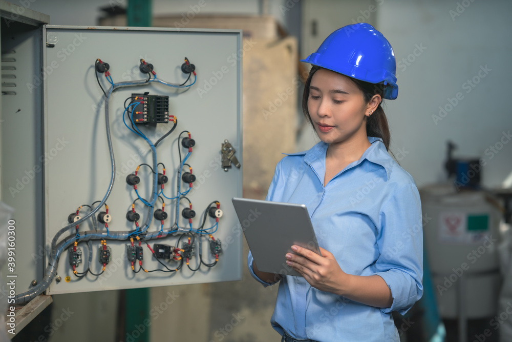 electrical engineer checking and maintenance electric control ...