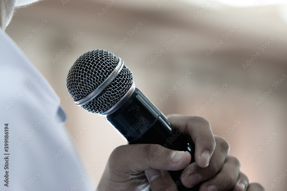 Smart businessman speaker speech with microphone at seminar conference ...