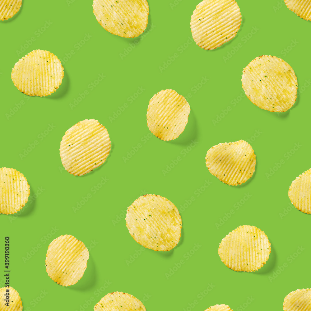 Seamless pattern made from Potato chips on green background flat lay ...