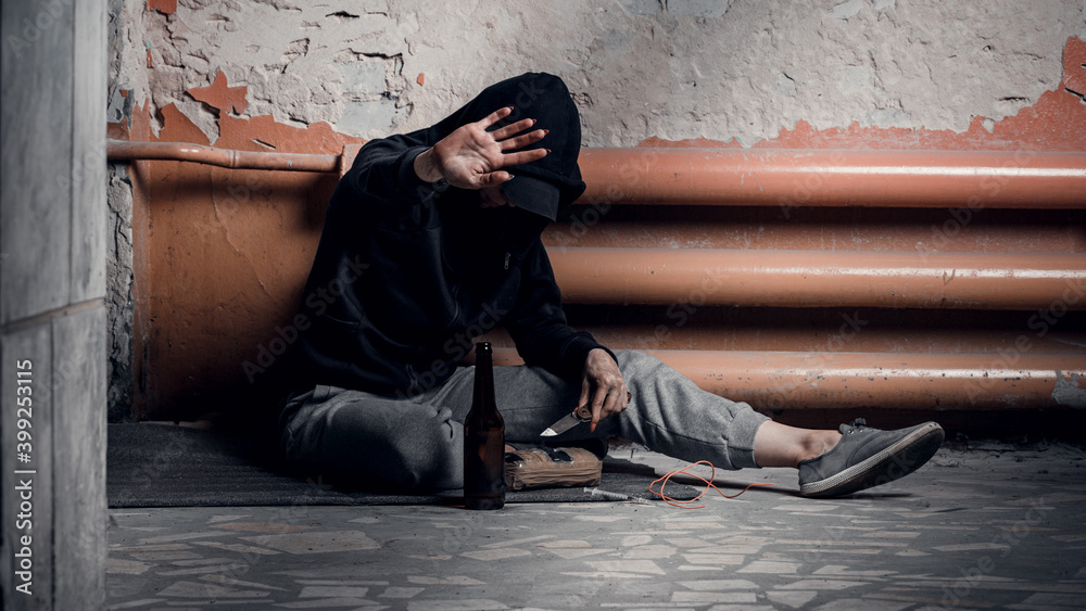Foto de The concept of drug addiction and homelessness. A depressed and ...