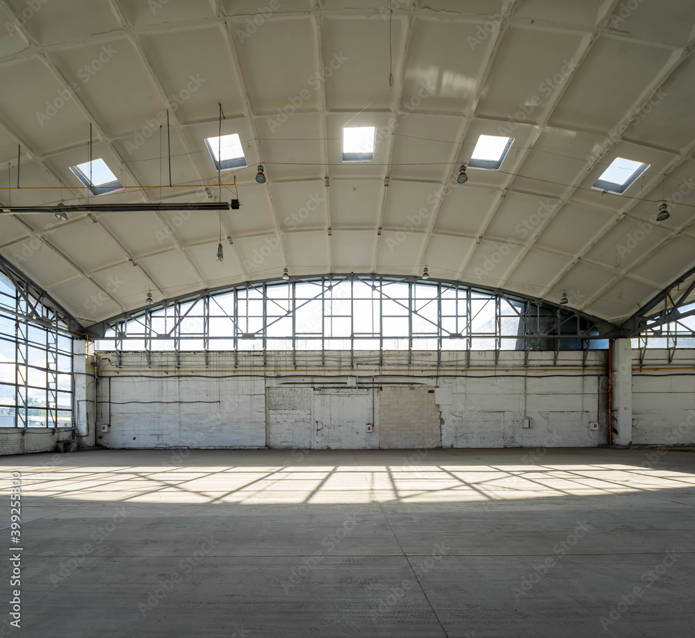 Wall of huge empty industrial warehouse. White interior. Unique soviet ...