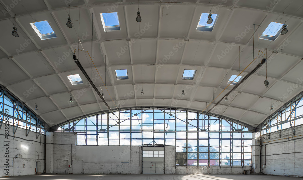 Huge empty industrial warehouse. White interior. Unique architecture ...