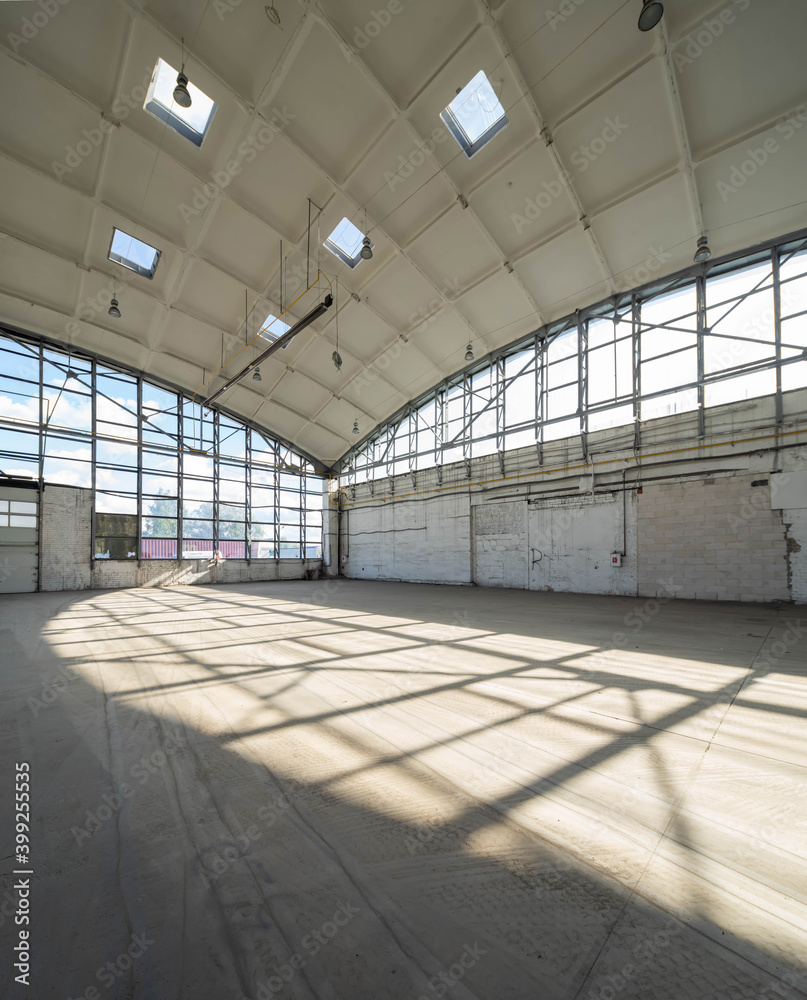 Huge empty industrial warehouse. White interior. Unique architecture ...