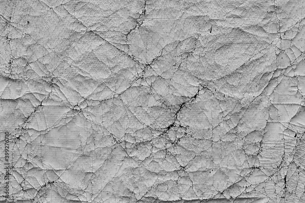 Battered creased faded blind. Folded shabby jute vinyl tent. Dirty ...