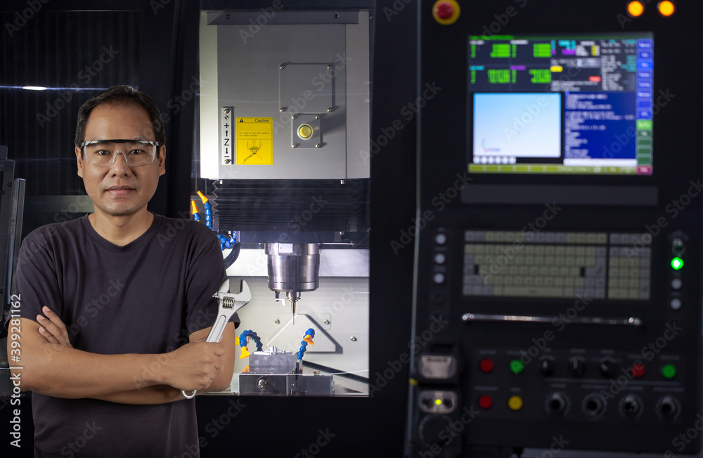 Asian industrial worker operate CNC milling machine cutting automotive ...