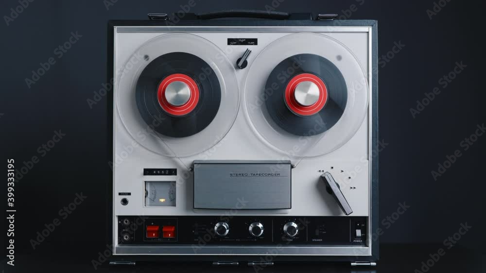 Reel to reel tape recorder playing rewind. Rotating vintage music ...