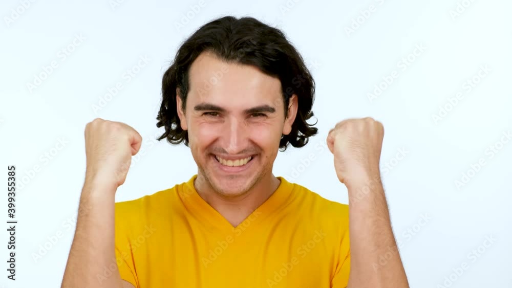 Excited man raising arms up, holding fists and screaming as achieving ...