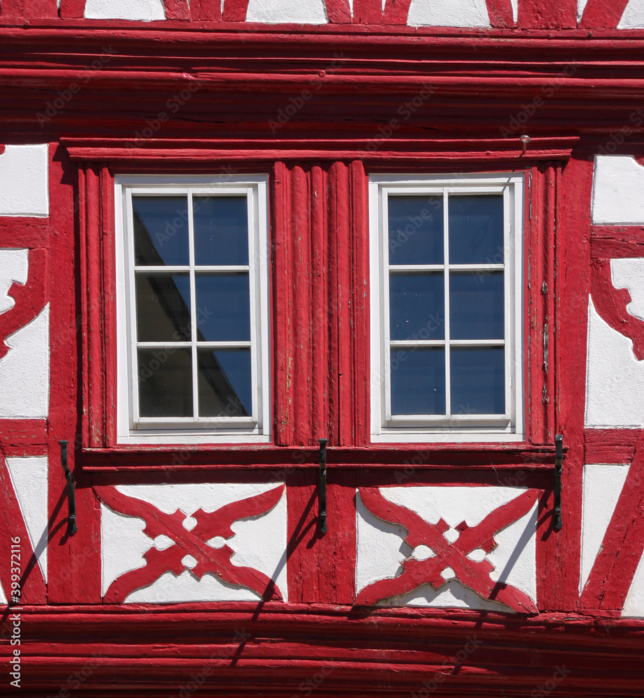 Renaissance window frame on a half-timbered house facade in the old ...