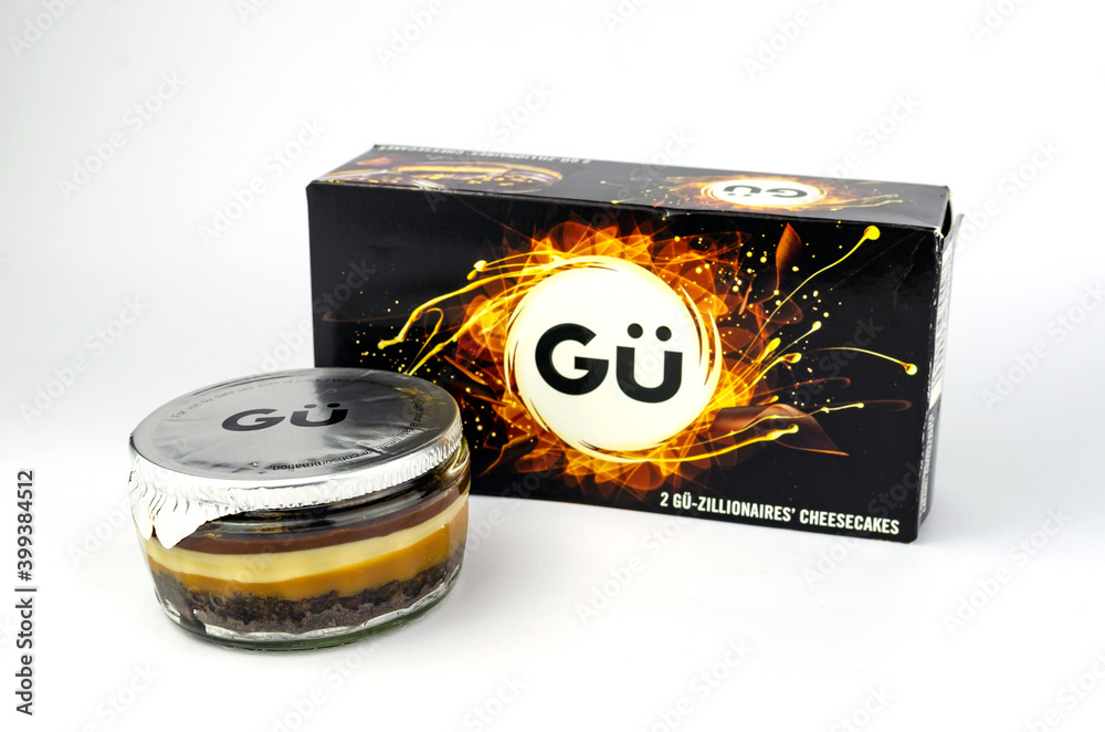 Gu layered cheesecake with the real gold flakes on top. Isolated on ...