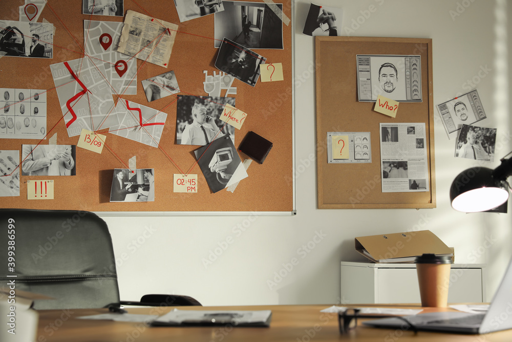 Detective office interior with big wooden desk and evidence board Stock ...