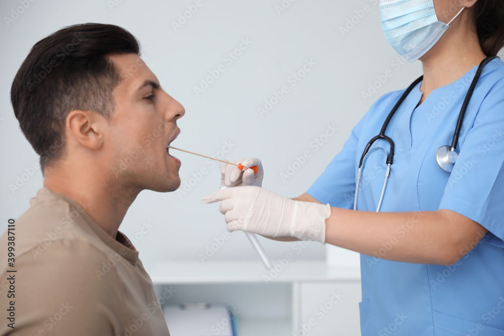 Doctor taking sample for DNA test from man in clinic Stock Photo ...