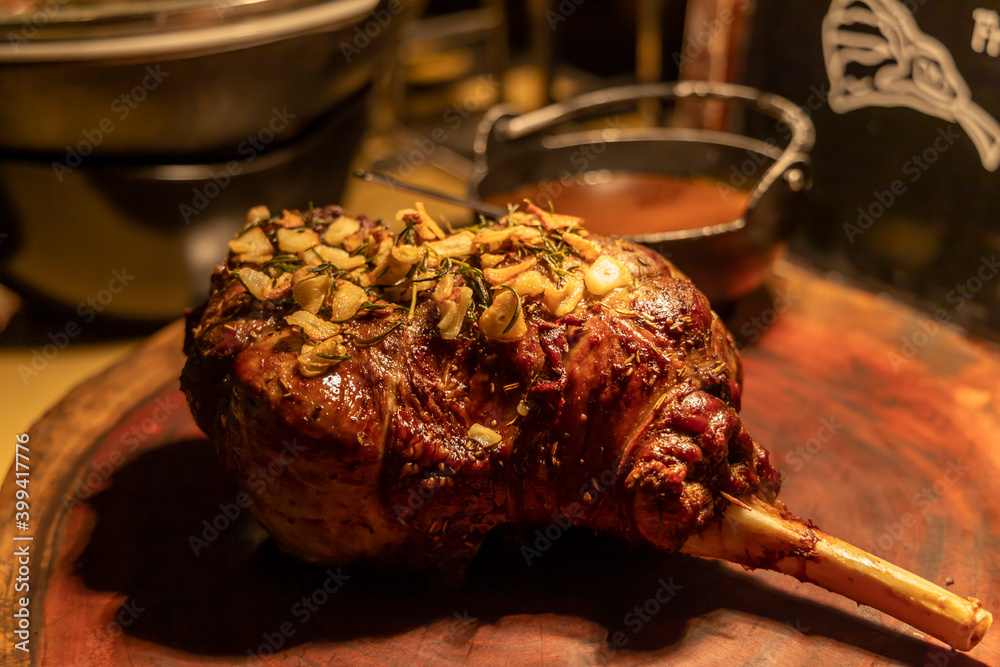 Buffet carving station with roasted lamb shank Stock Photo | Adobe Stock