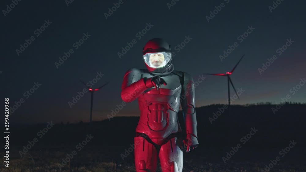 Cybernetic AI humanoid robot cyborg working on rural innovative wind station interacting virtual ...