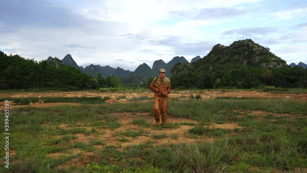 Video „Weary soldier tired from fighting walking through water and mud ...