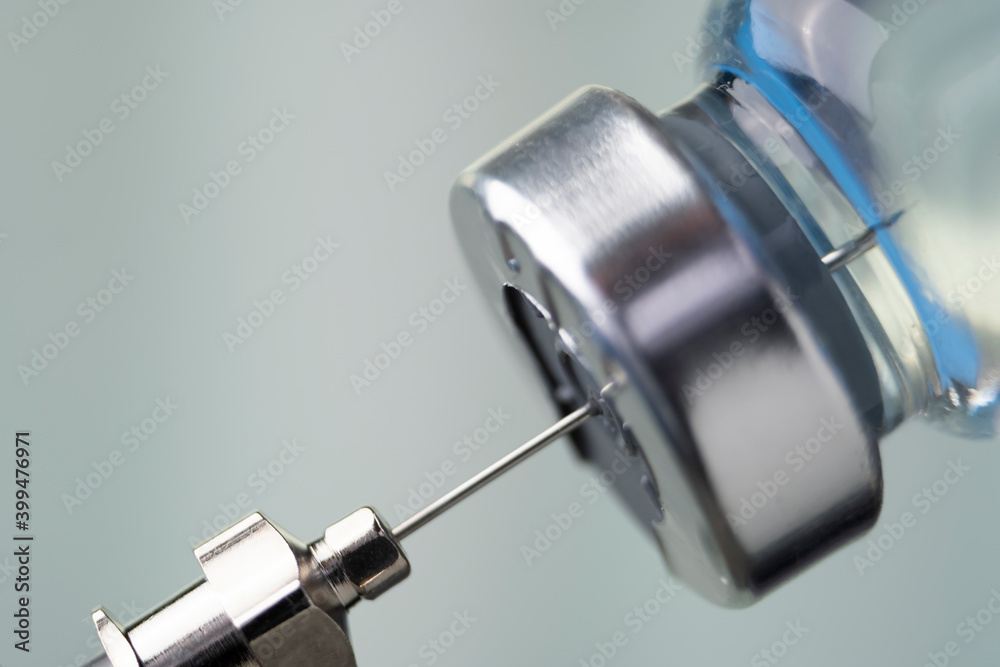 close up covid-19 vaccine vial dose with shot drug needle syringe Stock ...