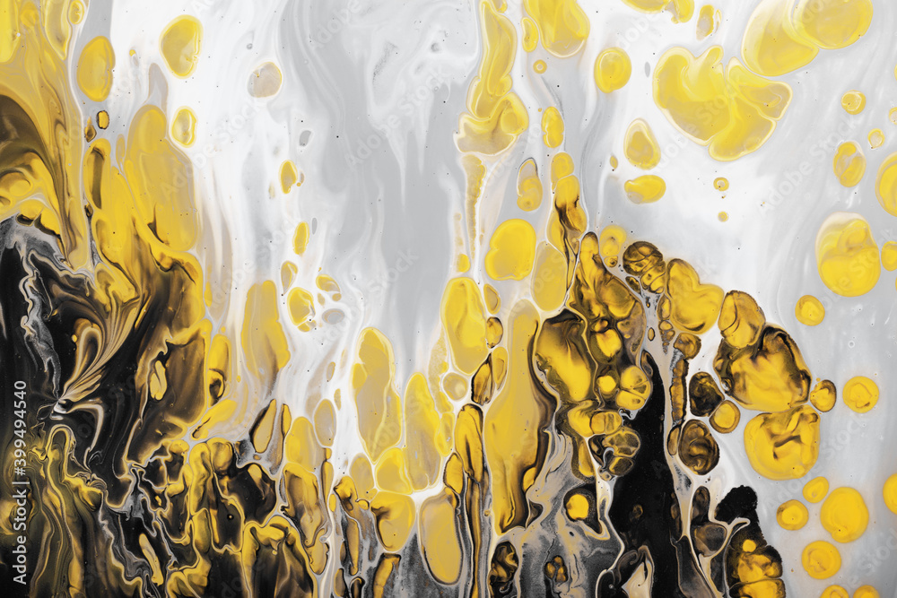 Trending colors of 2021. Flow of gray paint with yellow bubbles drops ...