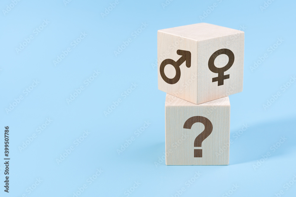 selection or changing gender concept. hand turns cube with the male and ...