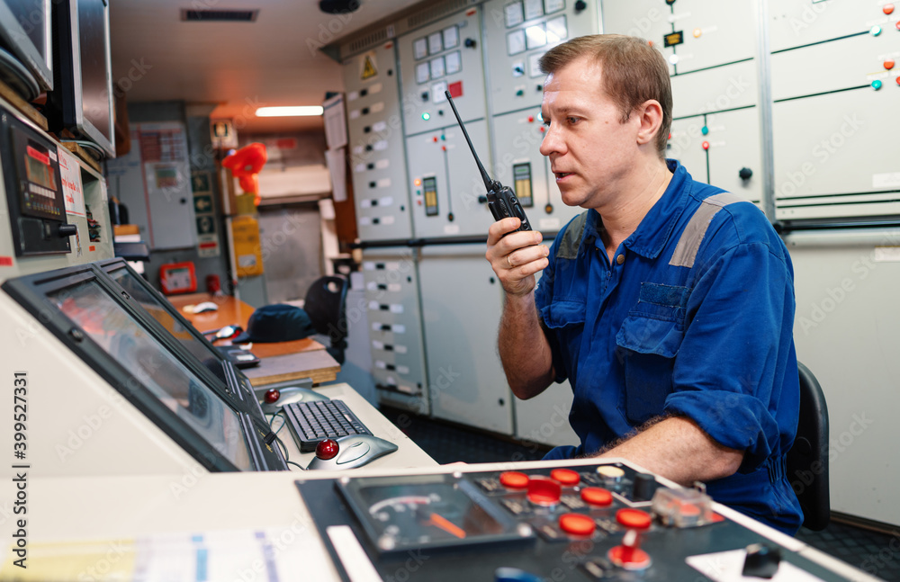 Foto de Marine engineer officer controlling vessel engines and ...