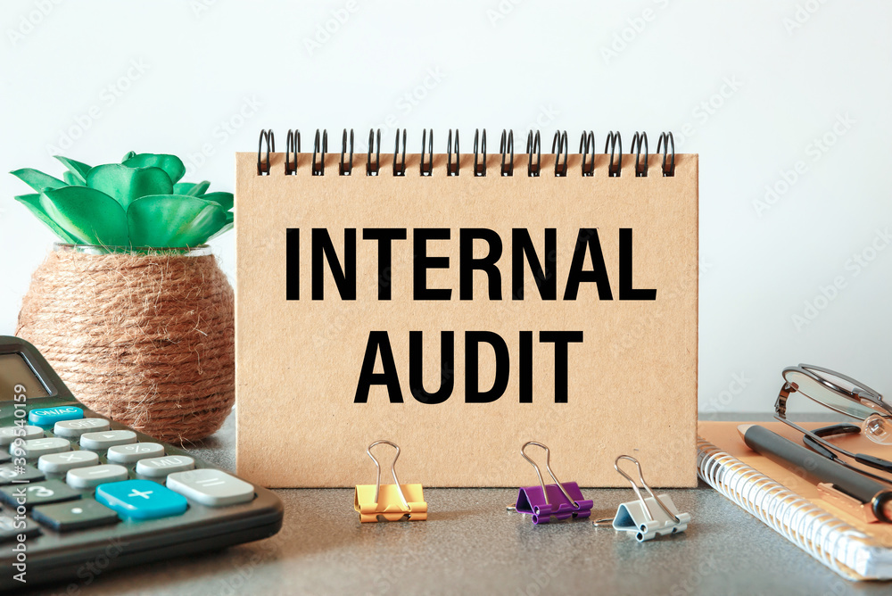 INTERNAL AUDIT is written on a notepad on an office desk Stock Photo ...