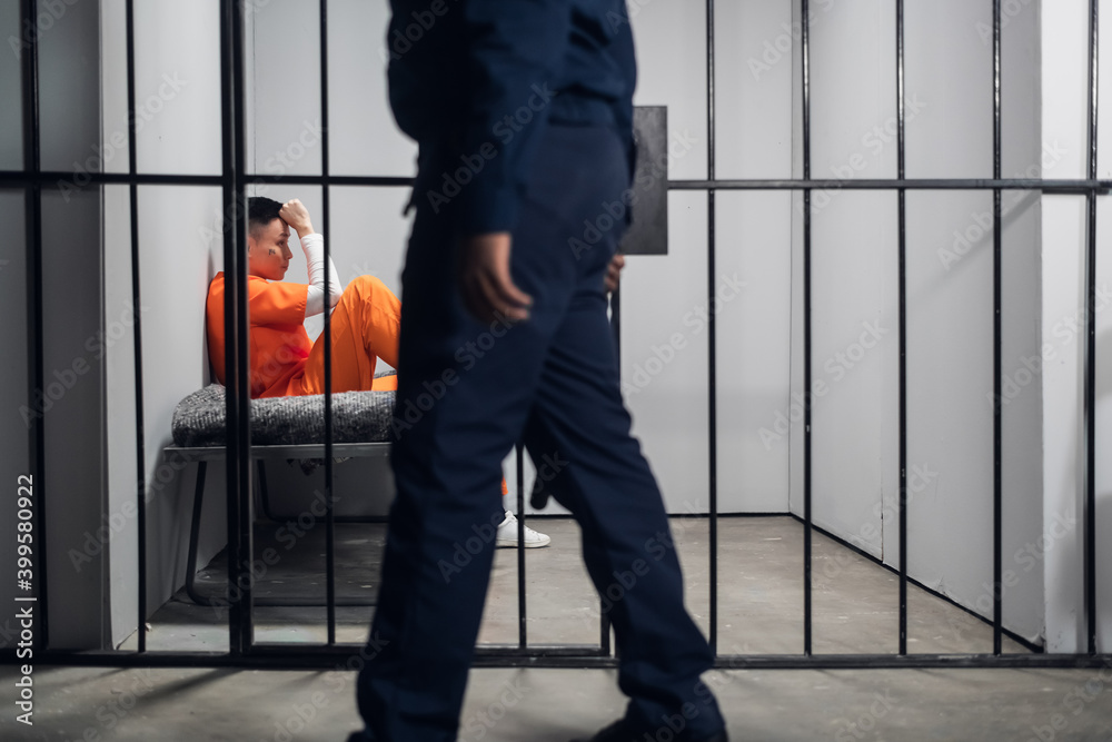 A prison guard makes a tour of the cells in a high-security prison. The ...