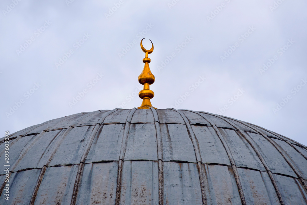 Vintage rustic dome of an old mosque with a golden crescent moon ...