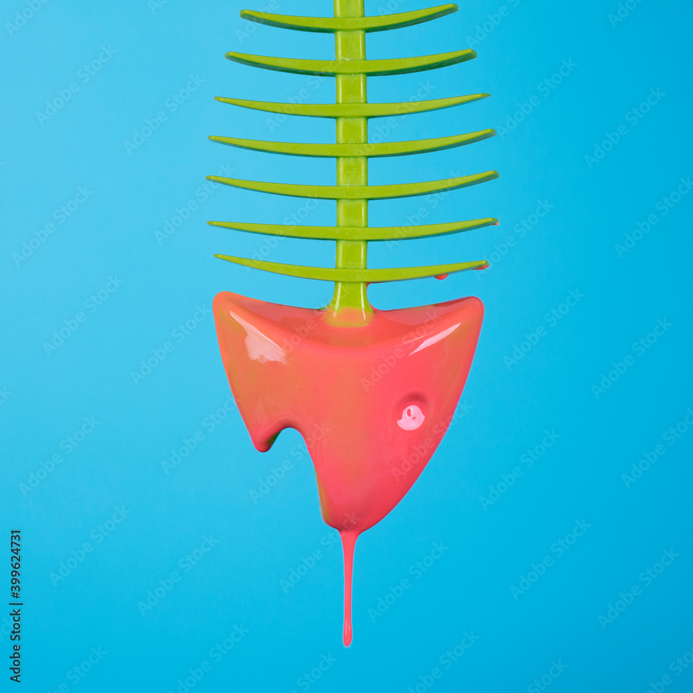 Fishbone with pastel pink paint dripping on blue background Stock Photo ...