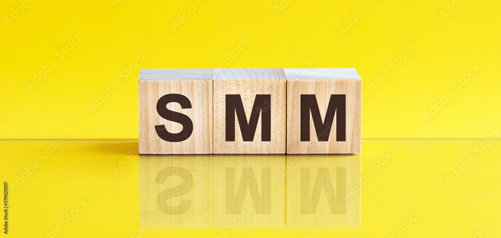 SMM - acronym from wooden blocks with letters, concept. SMM - Social ...