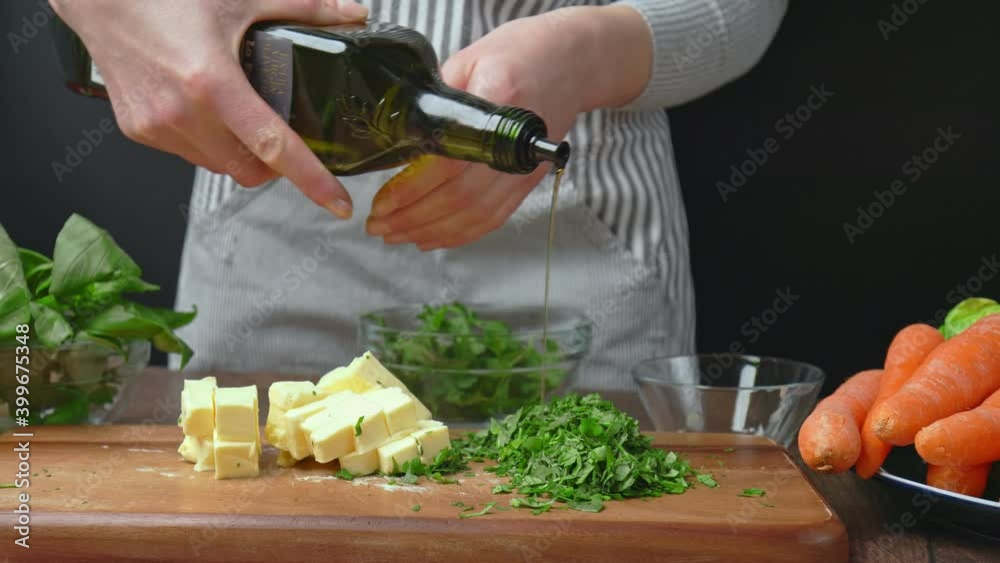 Preparing a marinade for Roast Chicken made from spices, basil leaves ...