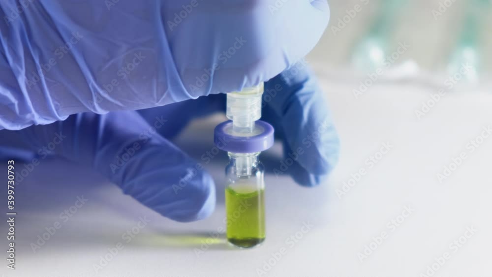 Scientist filtering a plant sample using syringe filter before HPLC ...