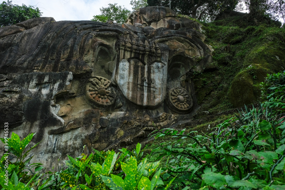 Sculptures carved into the rock at the archaeological site of Unakoti ...