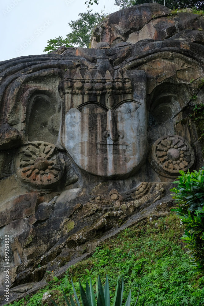 Sculptures carved into the rock at the archaeological site of Unakoti ...