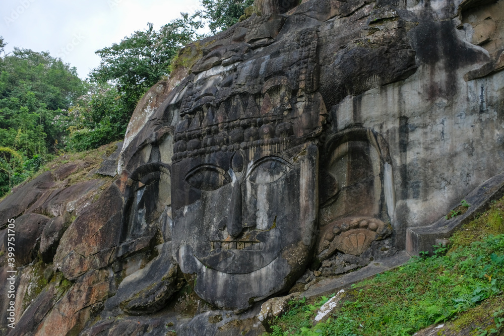 Sculptures carved into the rock at the archaeological site of Unakoti ...