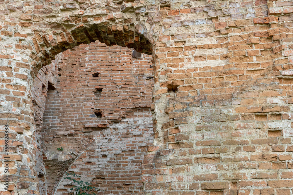 An old ruined red brick building. Arched vault. A place where there was ...