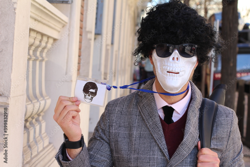 Businessman with skeleton face showing id card Stock Photo | Adobe Stock