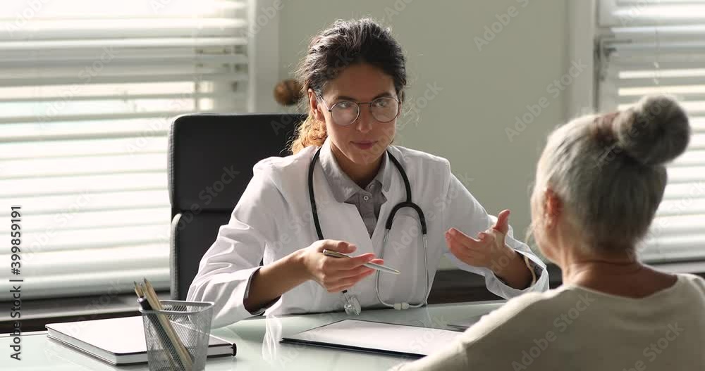 Female cardiologist explain coronary heart disease treatment during ...