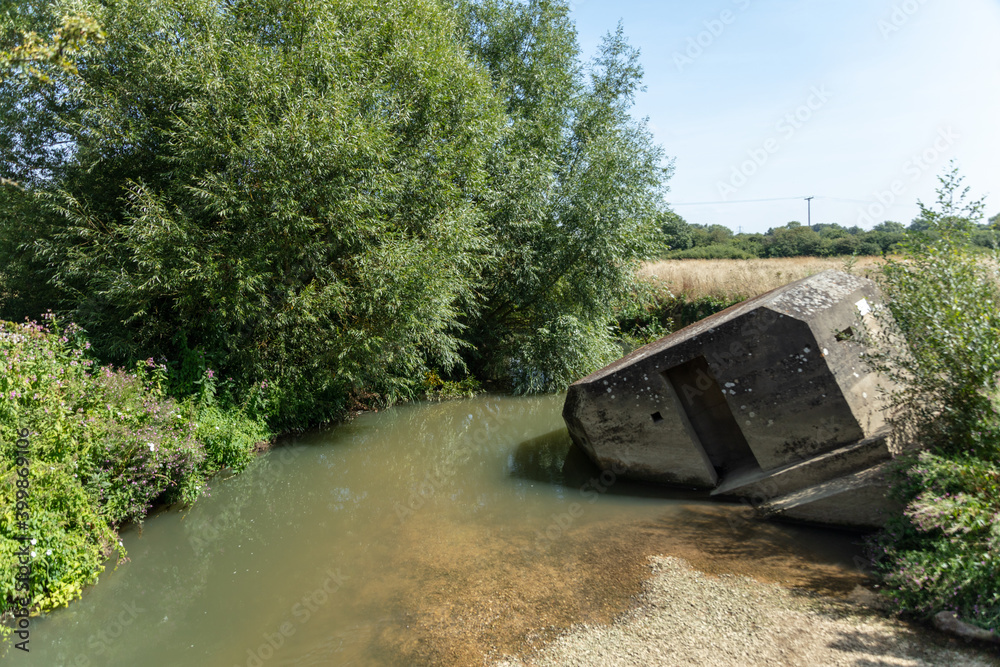 Old pill box WW2 defensive position collapsing into a river. Stock ...