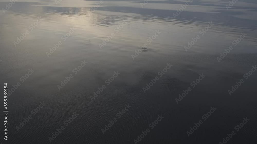 Pure current of sea water with reflection of the sky. Water rapid ...