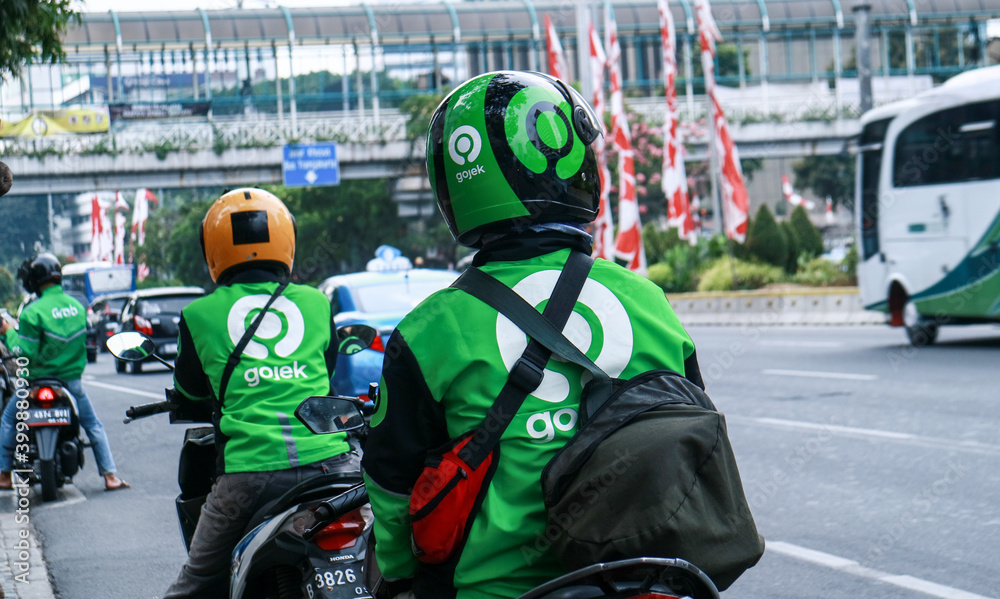 Jakarta, Indonesia - August 28, 2019: Driver of Gojek, motorcycle taxi ...