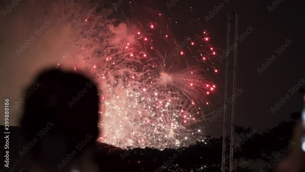 Female Spectator Taking Photo Of Beautiful Fireworks Over Marina Bay ...