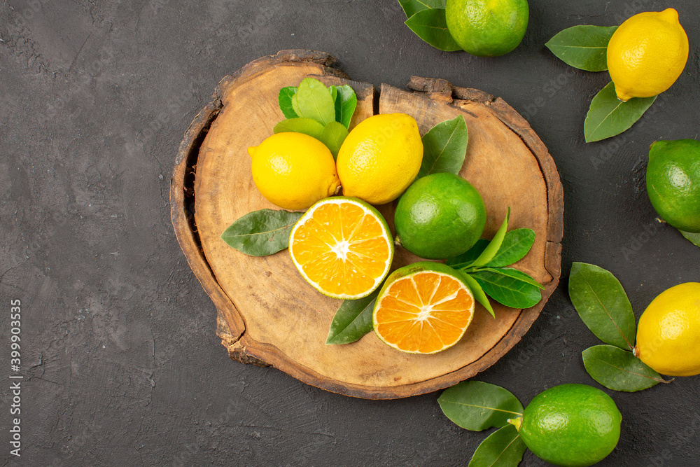 top view fresh sour lemons on dark background tree fruit citrus lime ...