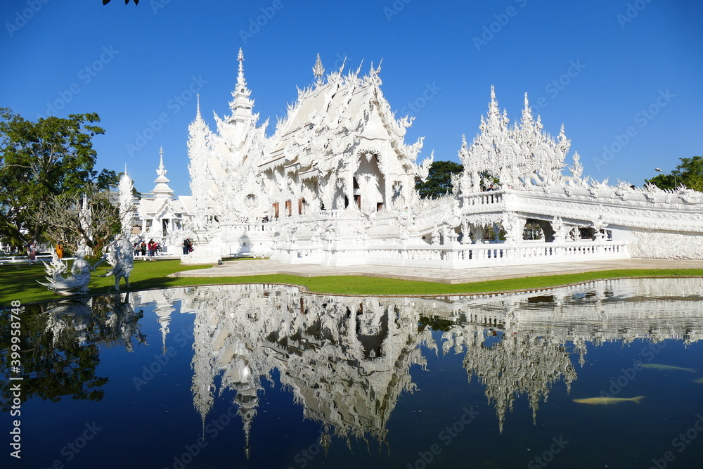 Magnificently grand white church and reflection in the water, Rong Khun ...