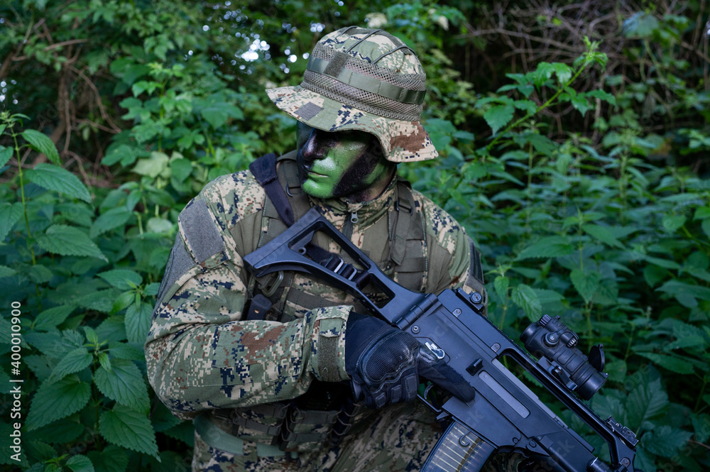 Croatia recon forces soldier camouflaging in the forest with the Cropat ...