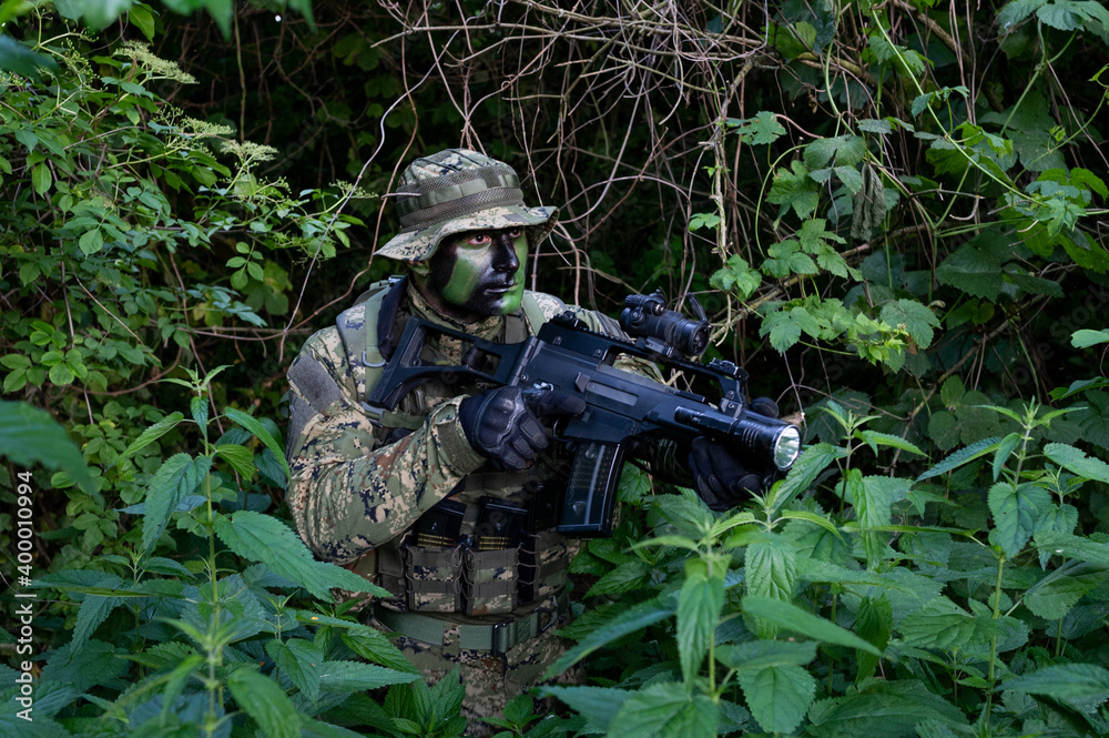 Poster Croatia recon forces soldier camouflaging in the forest with the ...